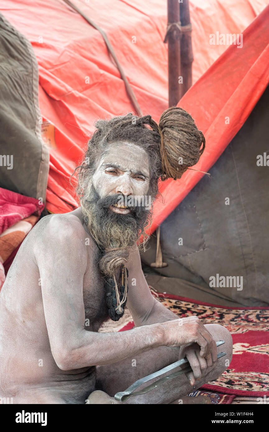 White ashes covered Sadhu with dreadlocks turned around his head, For ...