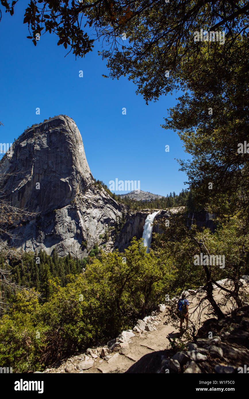 Vertical view of Nevada Fall and Liberty Cap from John Muir Trail with ...