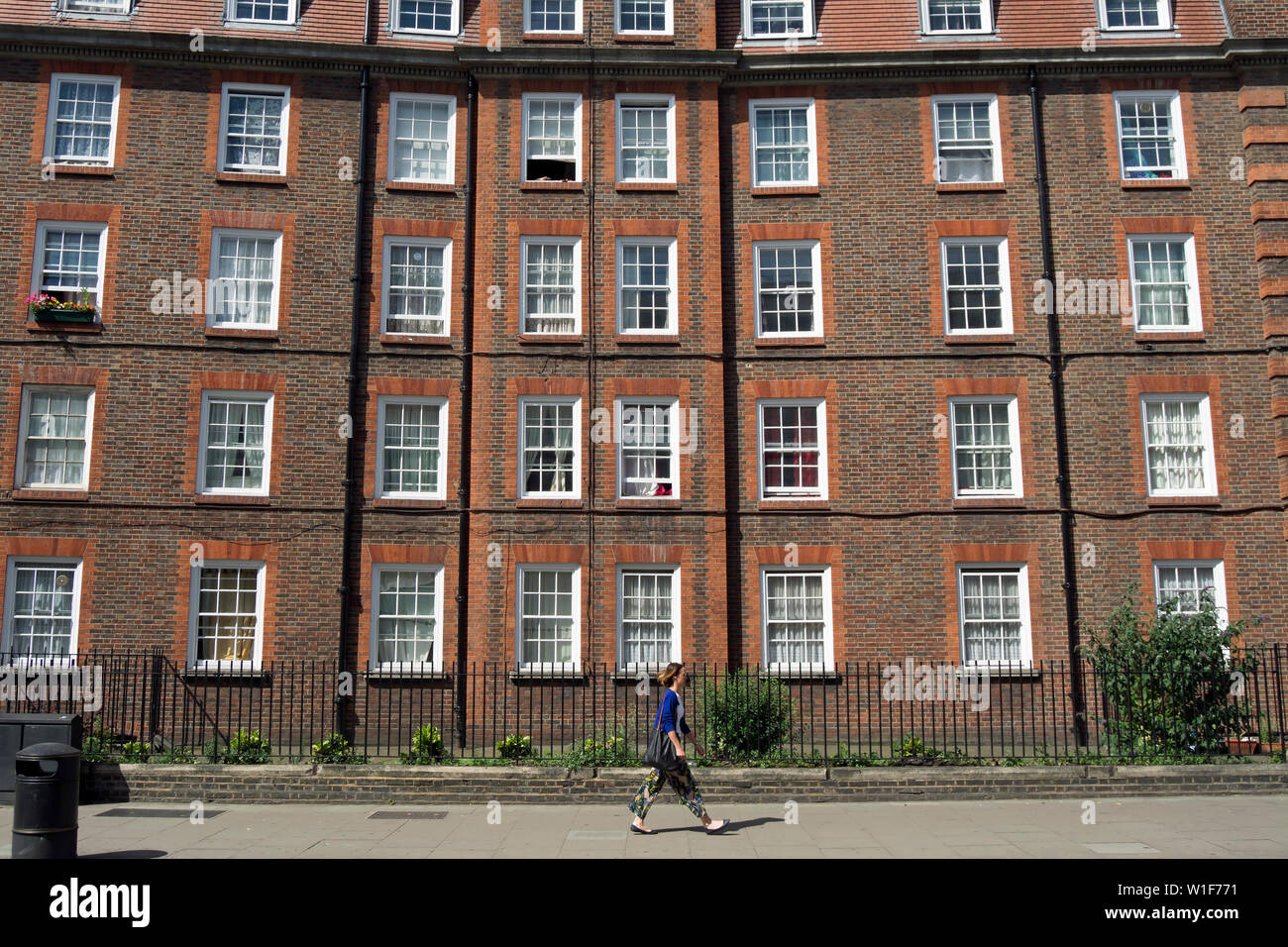 a woman passes the exterior of a building forming part of the 1926 ...