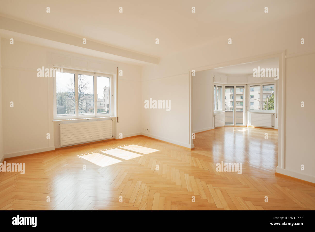 Interior of a modern empty apartment with big windows Stock Photo - Alamy