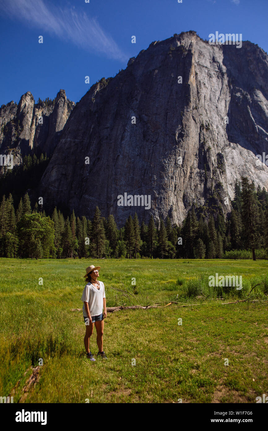 Tourist caucasian woman in her thirties posing facing the sun with El ...