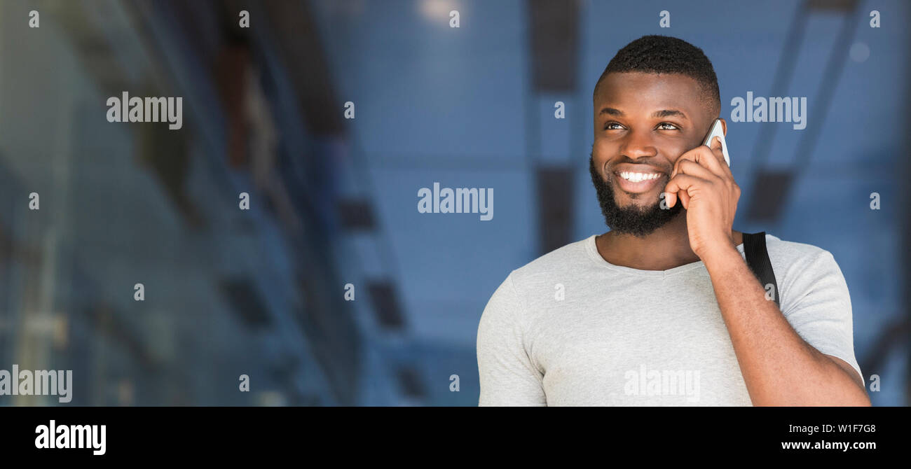 Young attractive businessman making phone call and smiling Stock Photo ...