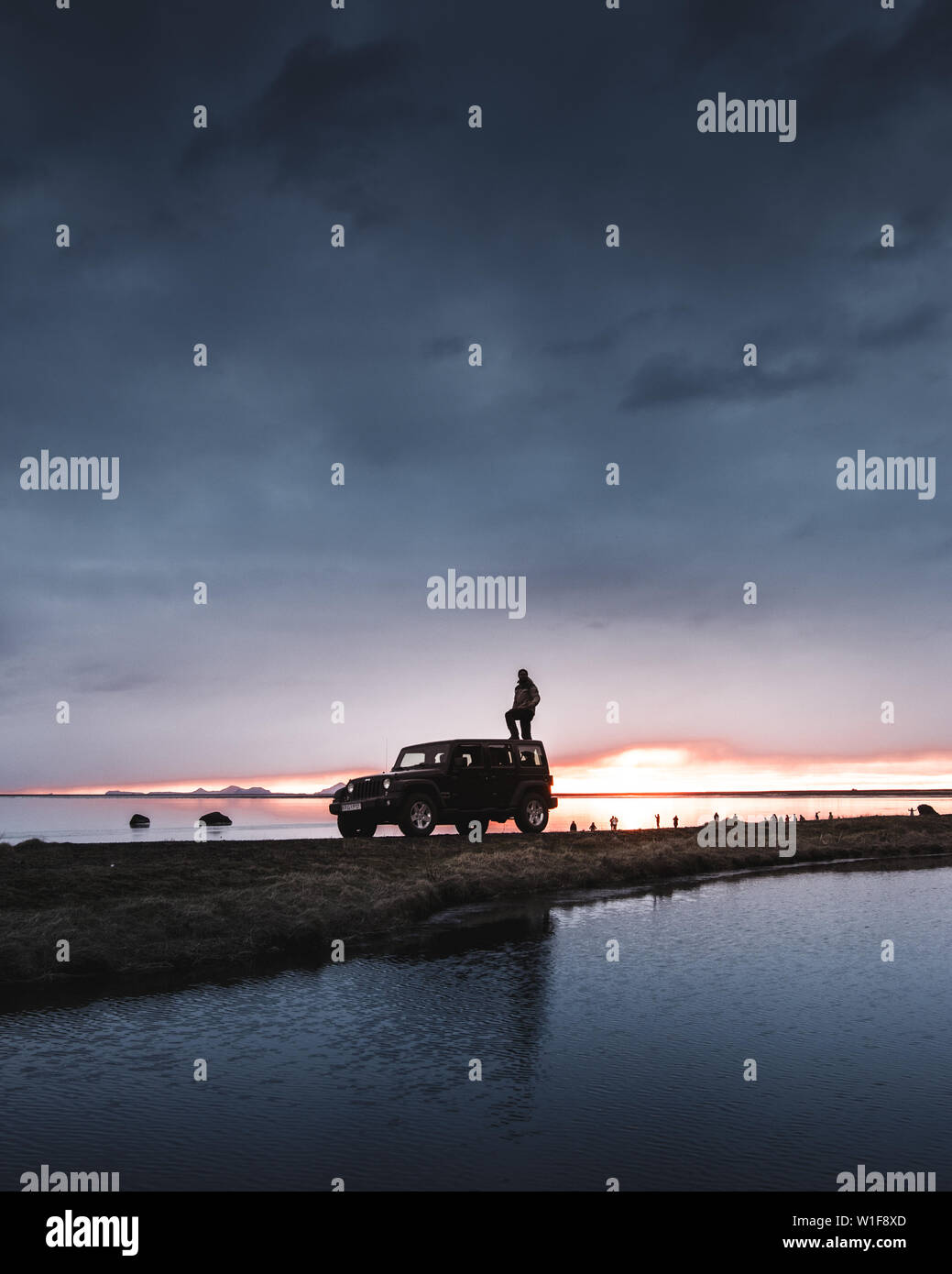 vehicle sunset landscape water dawn Stock Photo - Alamy