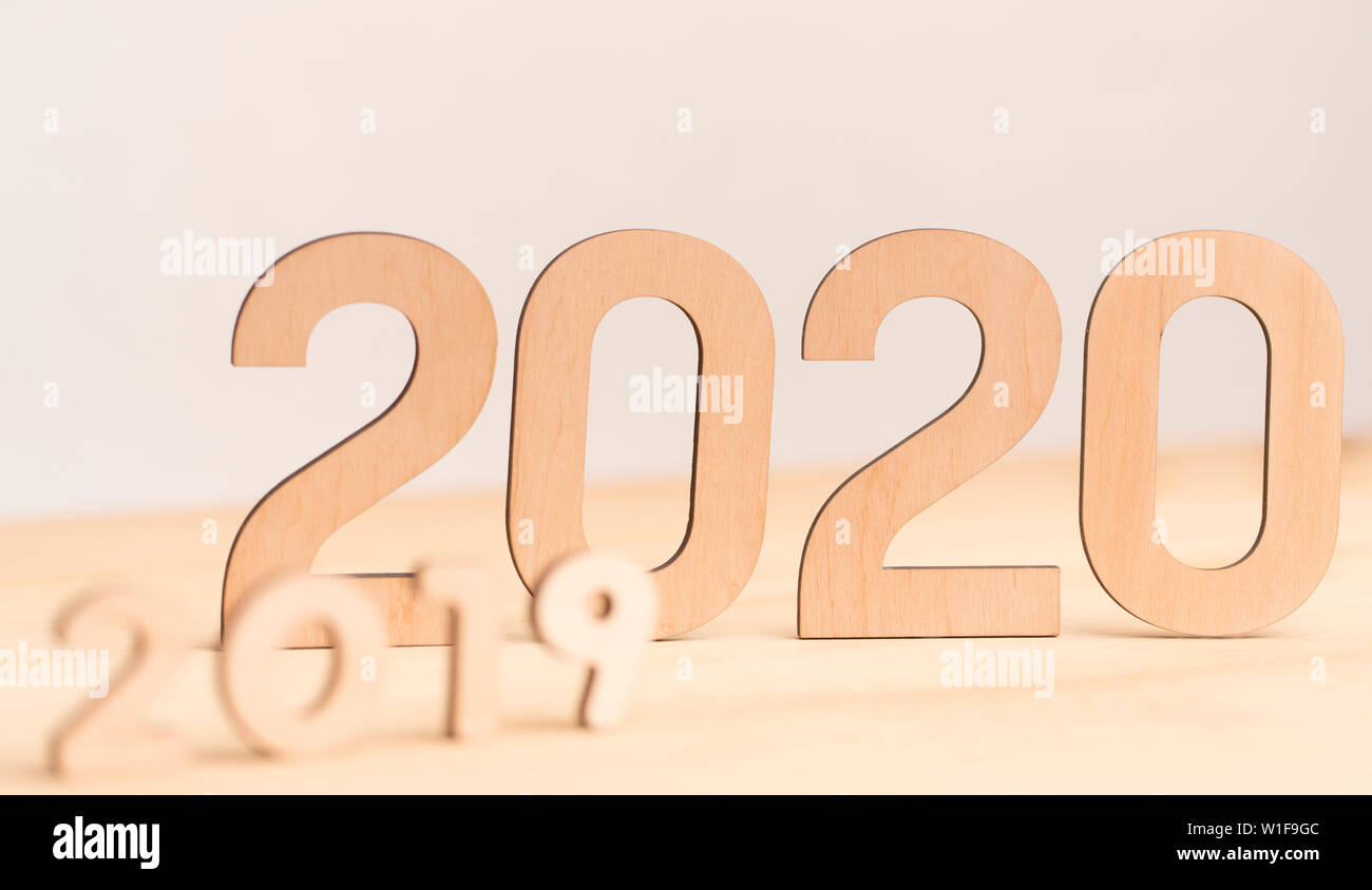 Wooden numbers from 2019 to big 2020 on light background Stock Photo ...