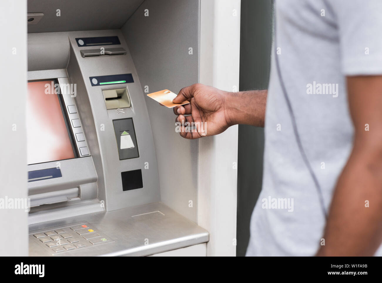 Person using a atm hi-res stock photography and images - Alamy