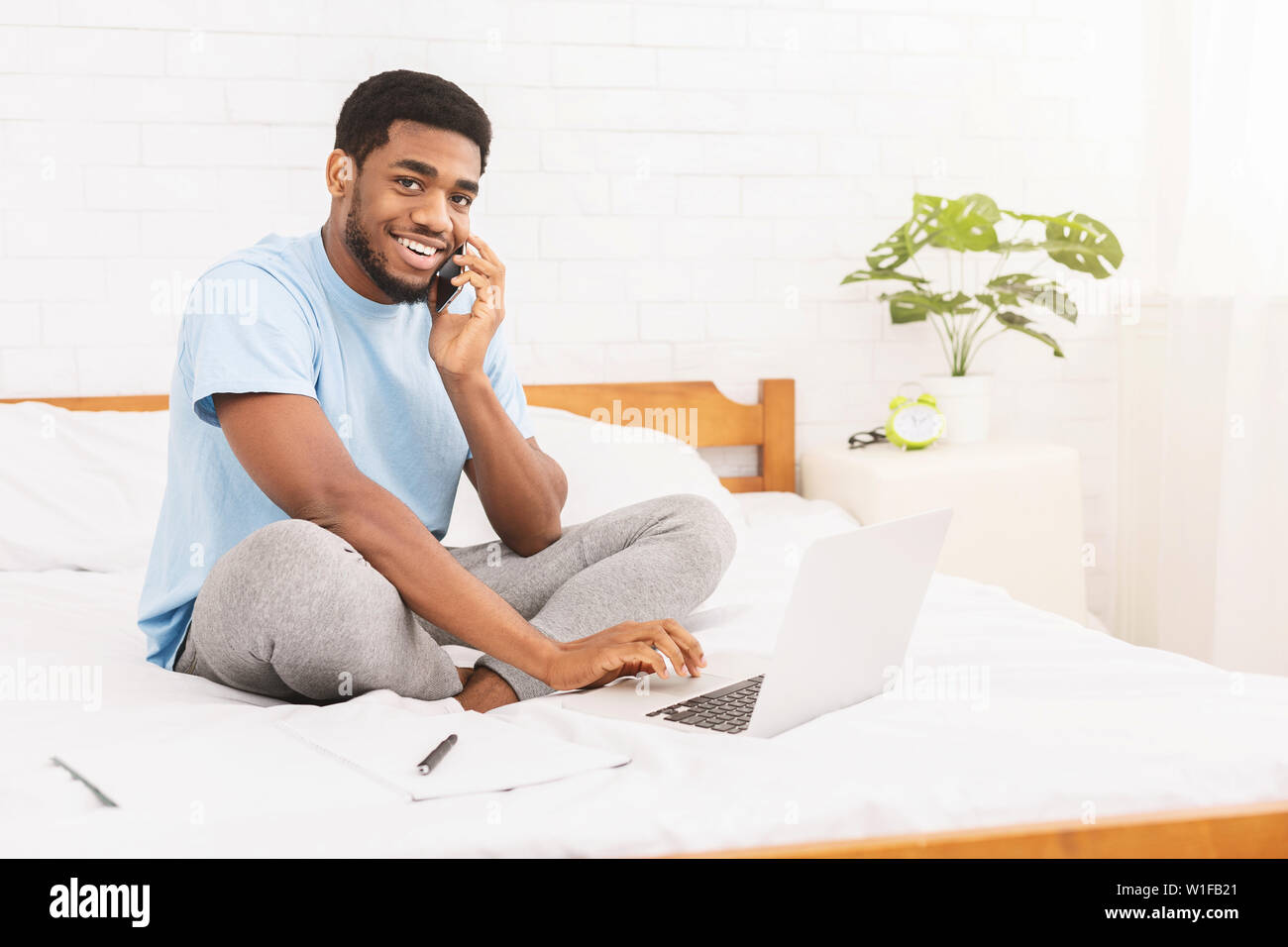 Male college student multitasking hi-res stock photography and images ...