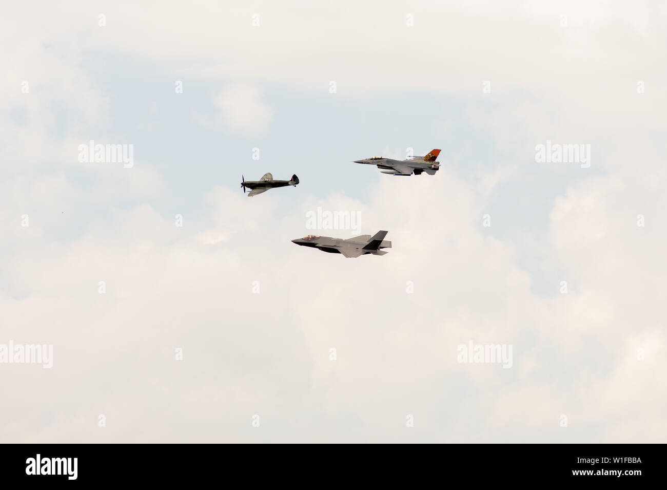 F-35 Lightning II with weapon bay doors open, F-16 and a historic ...