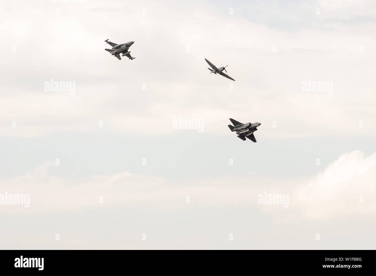 F-35 Lightning II with weapon bay doors open, F-16 and a historic ...