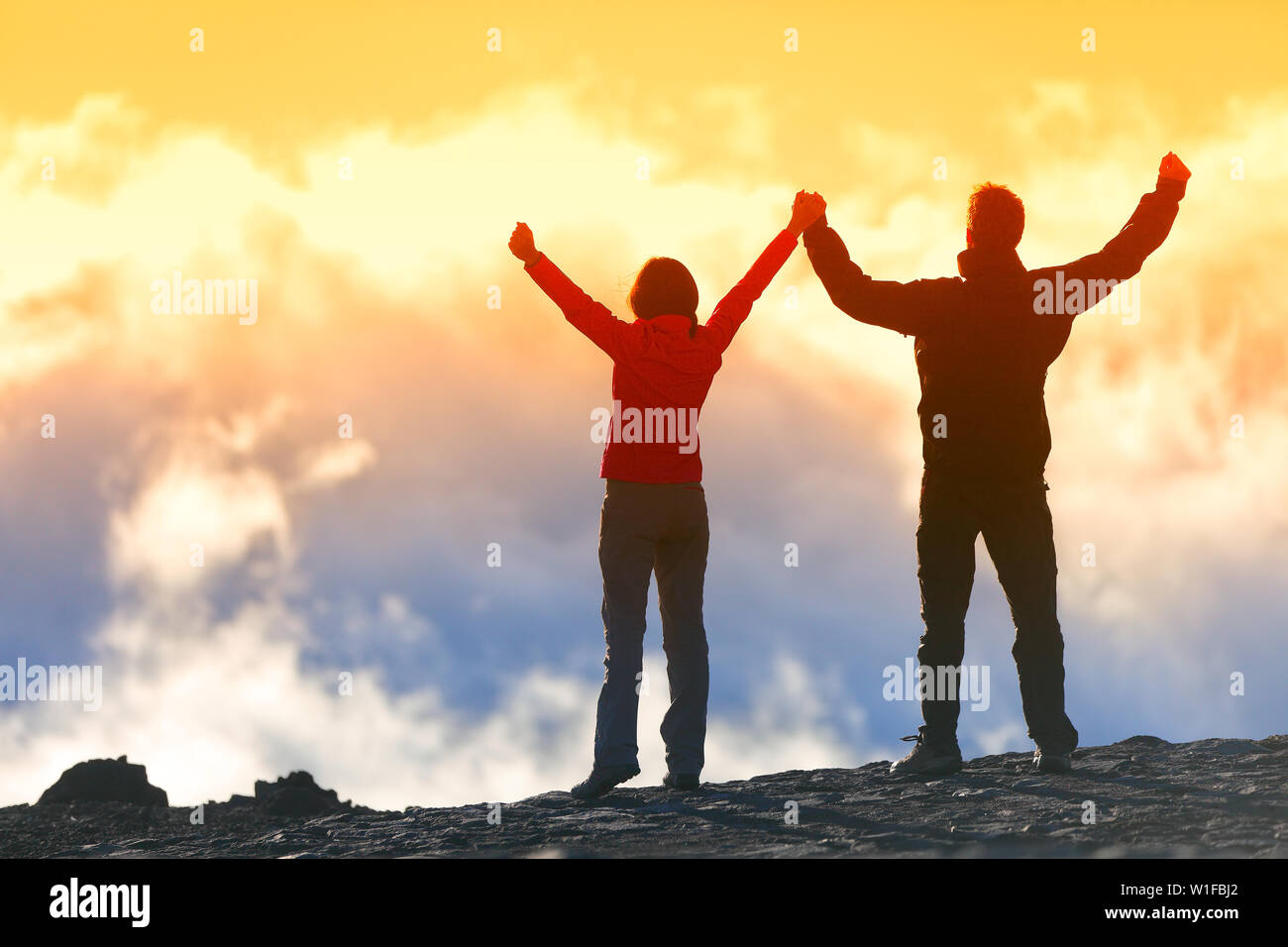 Happy winners reaching life goal - success people at summit. Business ...