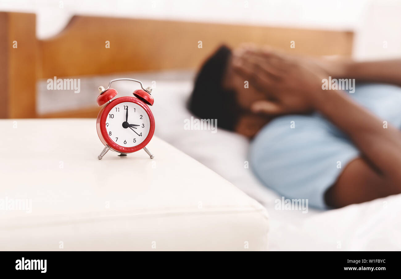 Black man in bed suffering from insomnia and sleep disorder Stock Photo ...