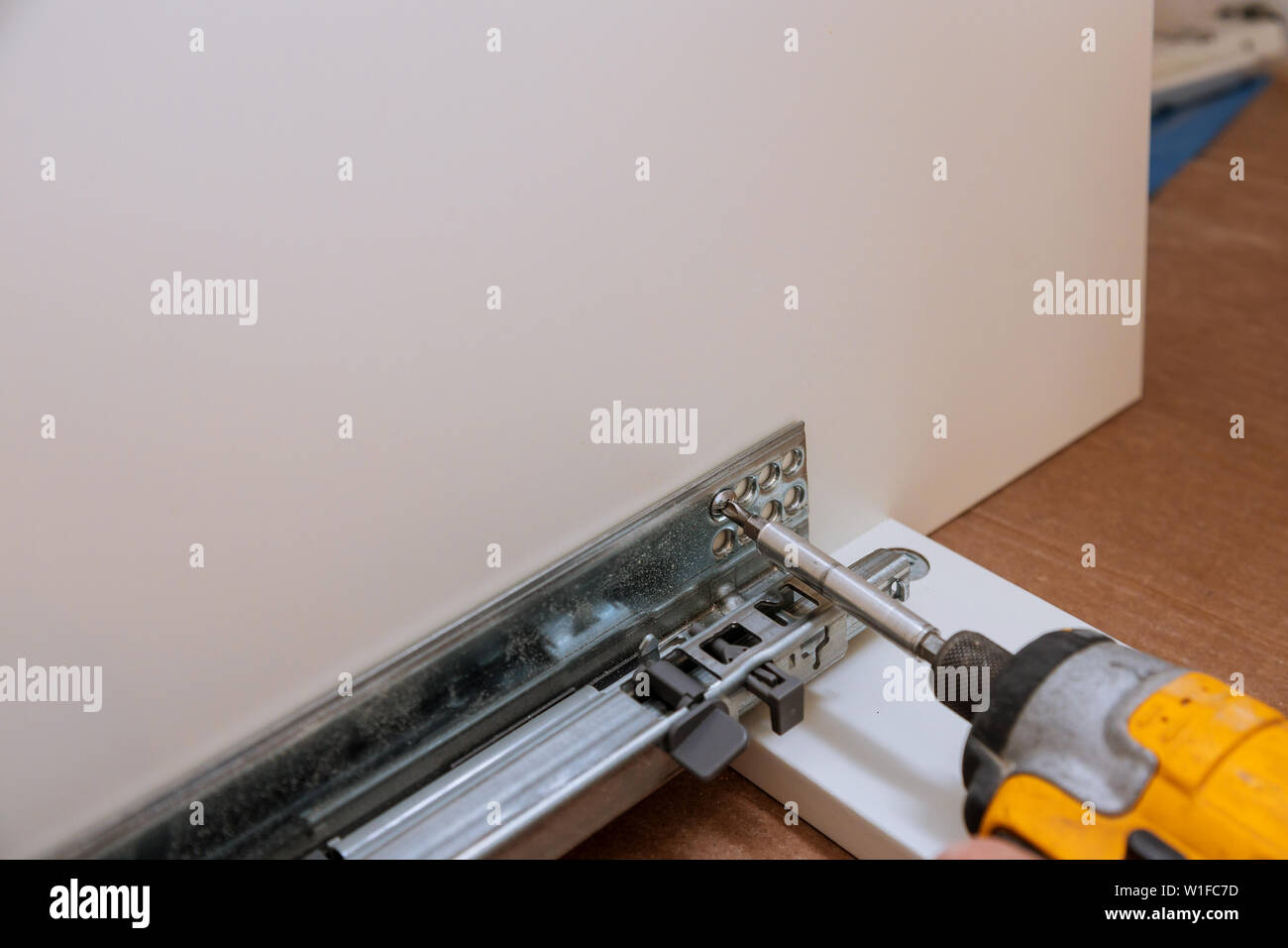 Mounting hinges for furniture accessories used when assembling kitchen ...