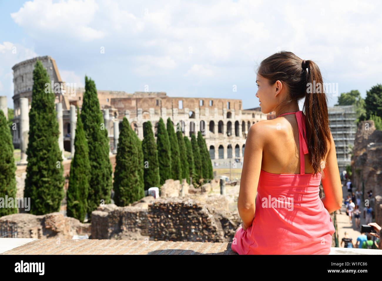 Italy travel - Woman tourist at Coliseum, Rome. Young Asian adult ...