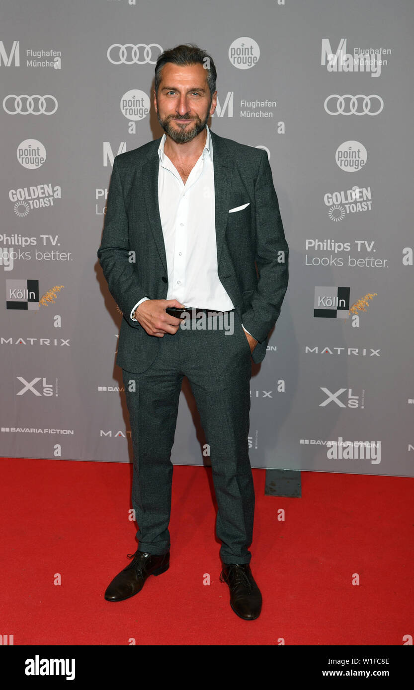Munich, Germany. 01st July, 2019. The actor Tim Seyfi stands on the red ...
