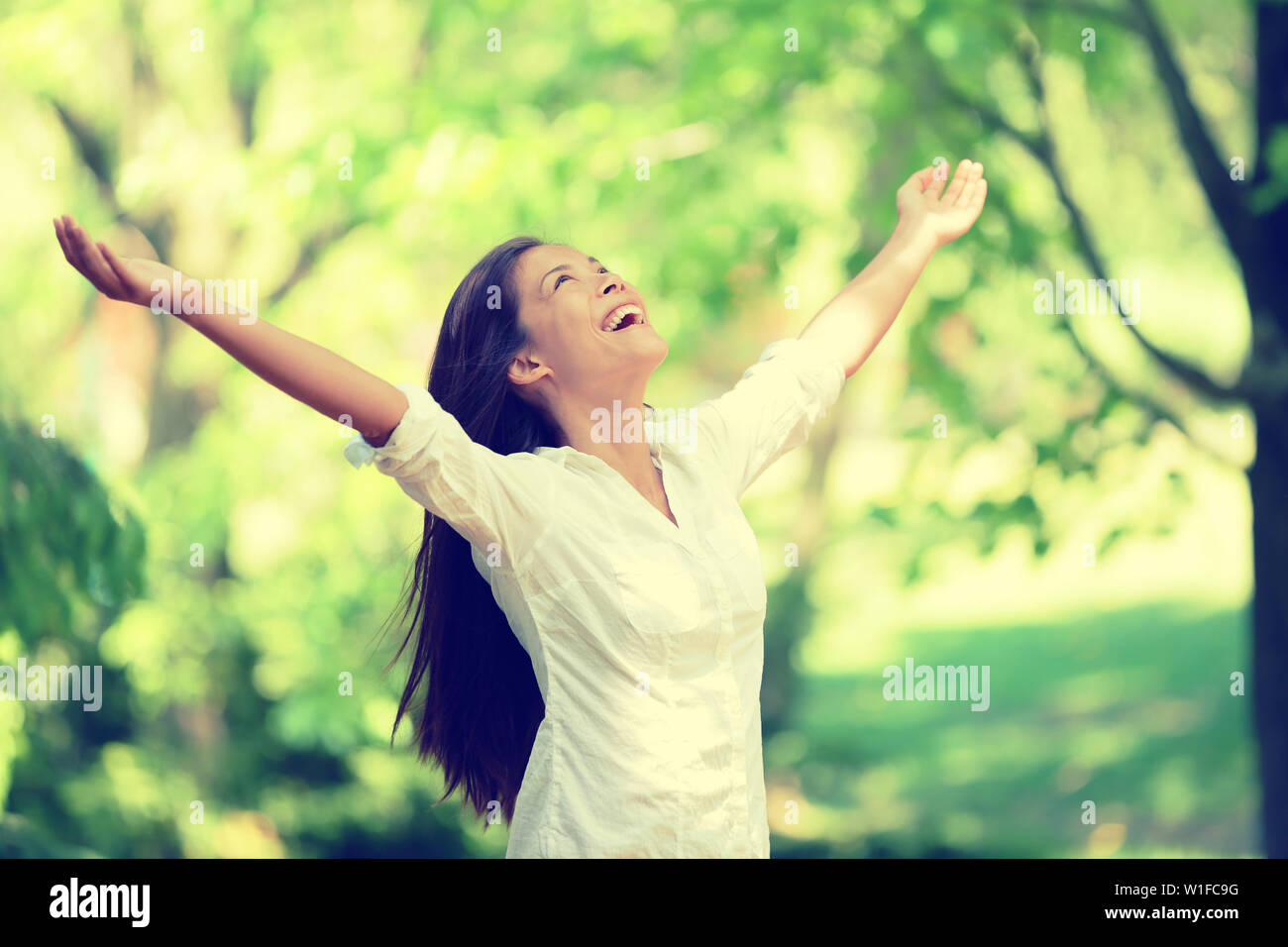 Freedom happy woman feeling alive and free in nature breathing clean ...