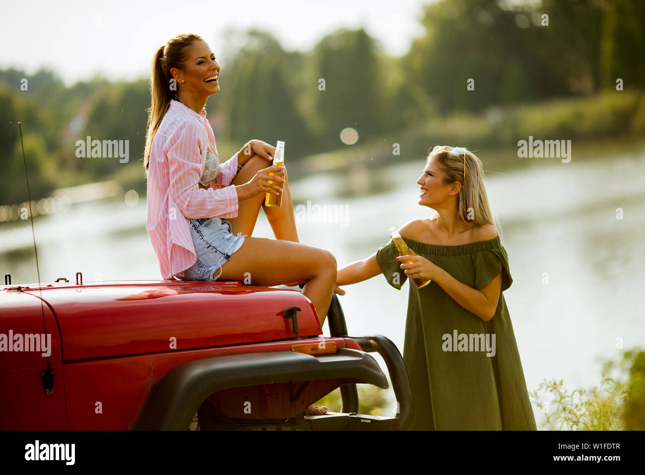 Two smiling young women on a trip hi-res stock photography and images ...