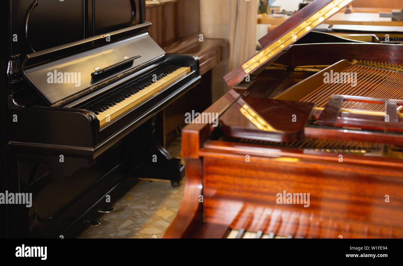 Old classical musical instruments in a music store Stock Photo - Alamy