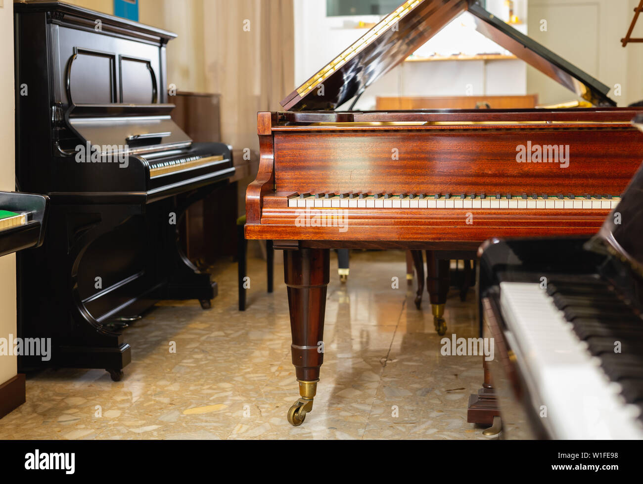 Old musical instruments in a music store Stock Photo - Alamy