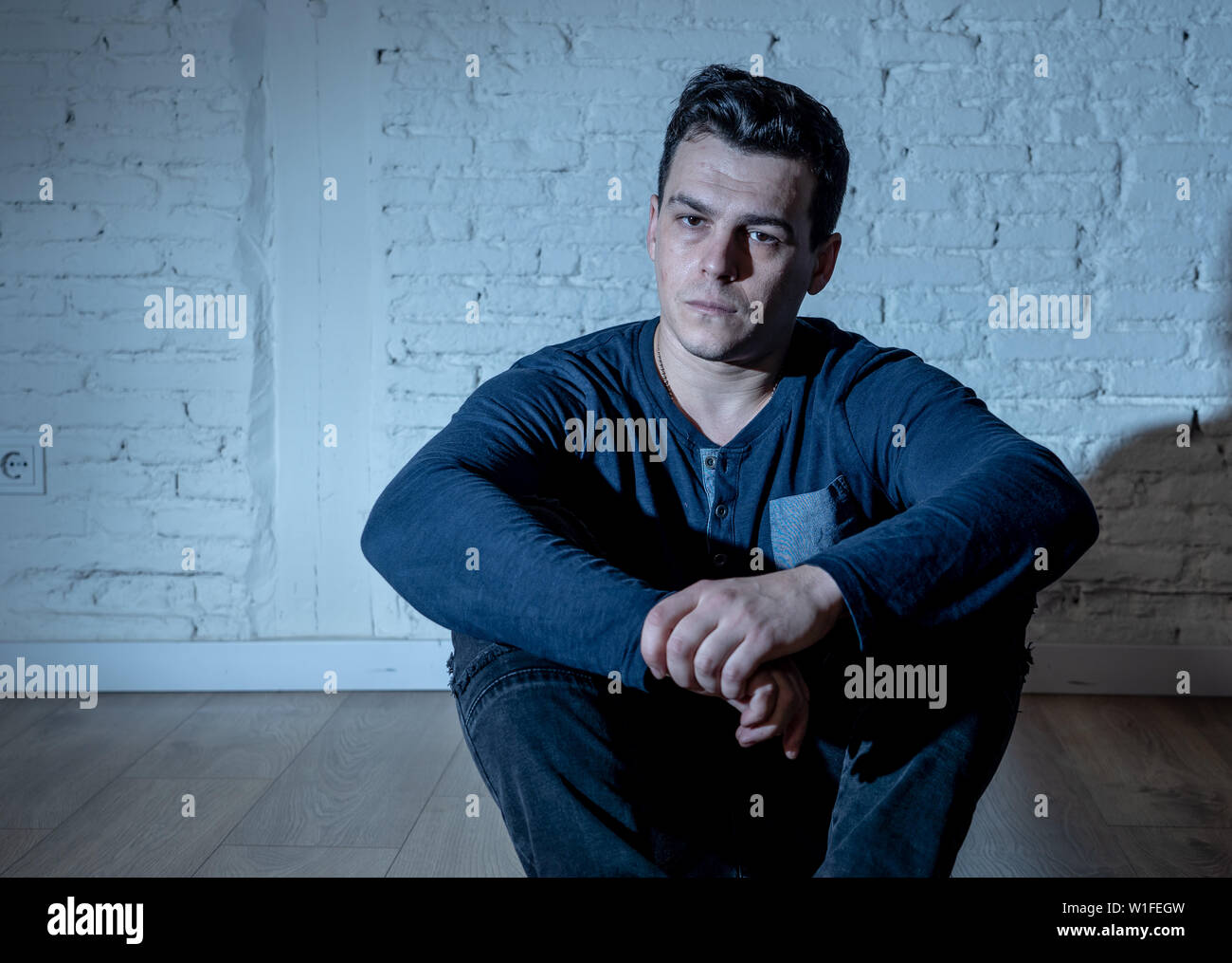 Portrait of sad depressed young man crying devastated feeling hurt ...