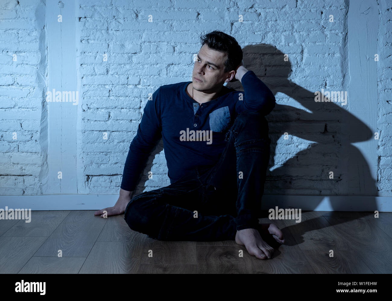 Portrait of sad depressed young man crying devastated feeling hurt ...