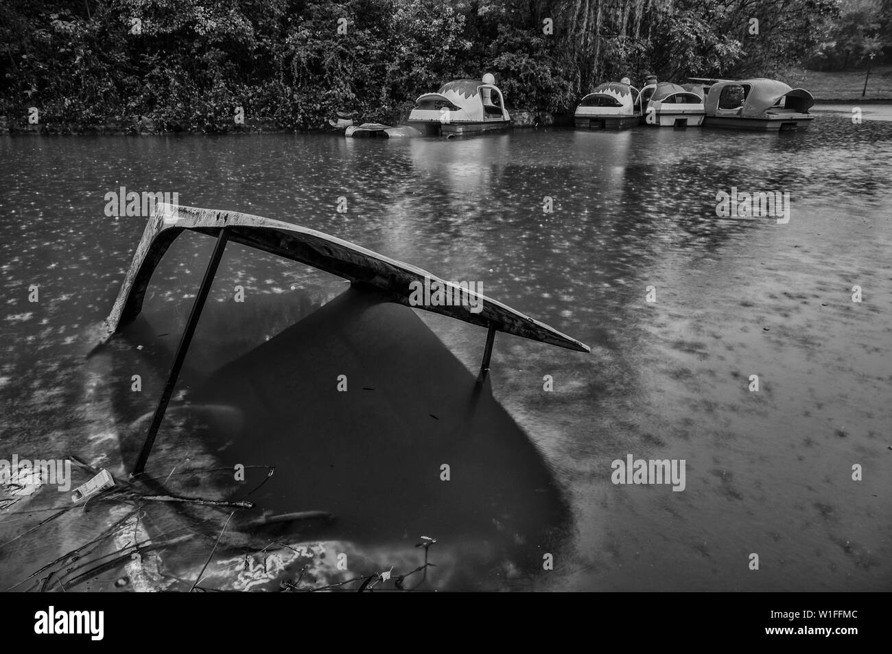 rowboat transportationsystem rain calamity canoe Stock Photo - Alamy