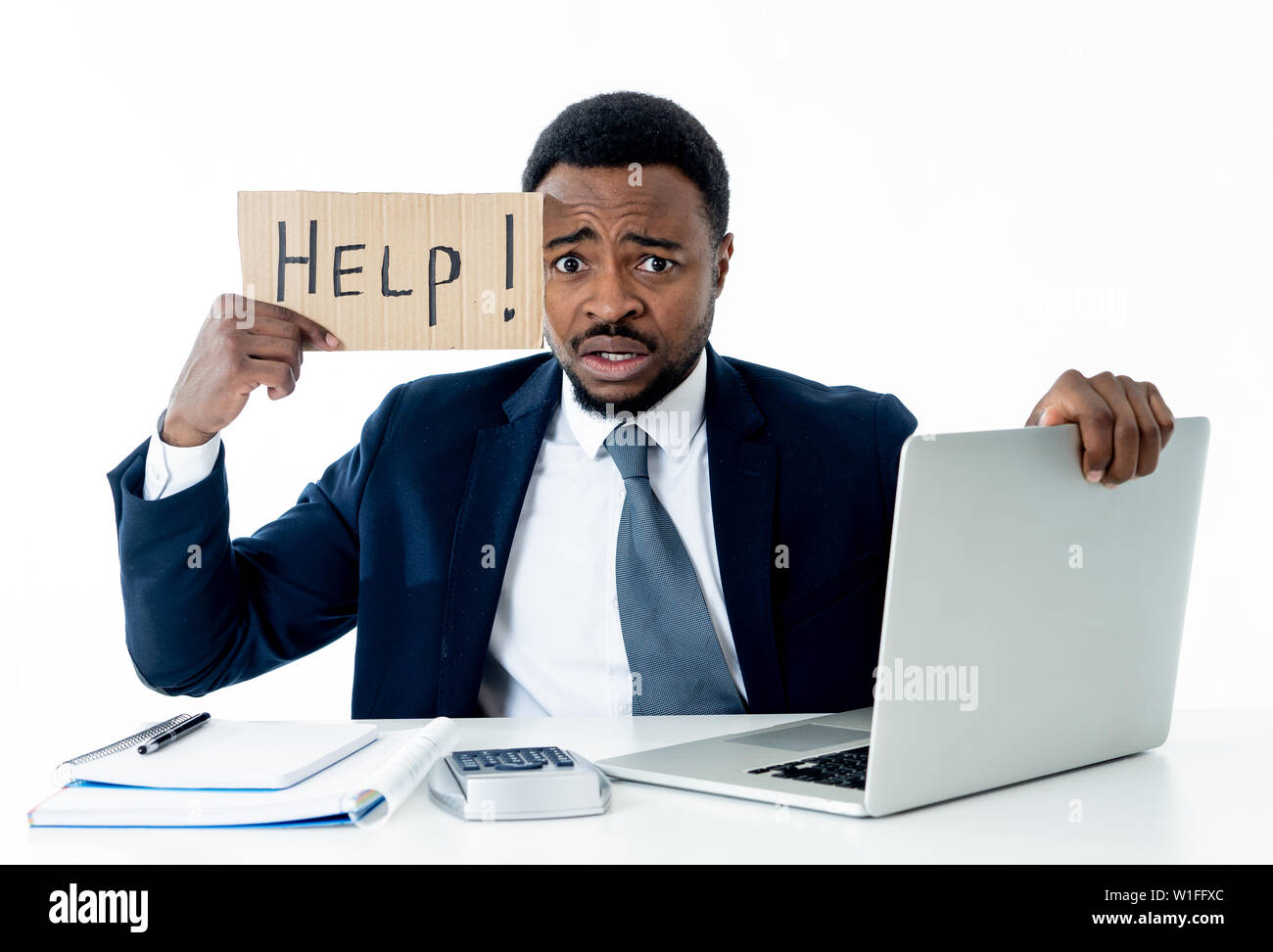 Desperate african american businessman with laptop computer suffering ...