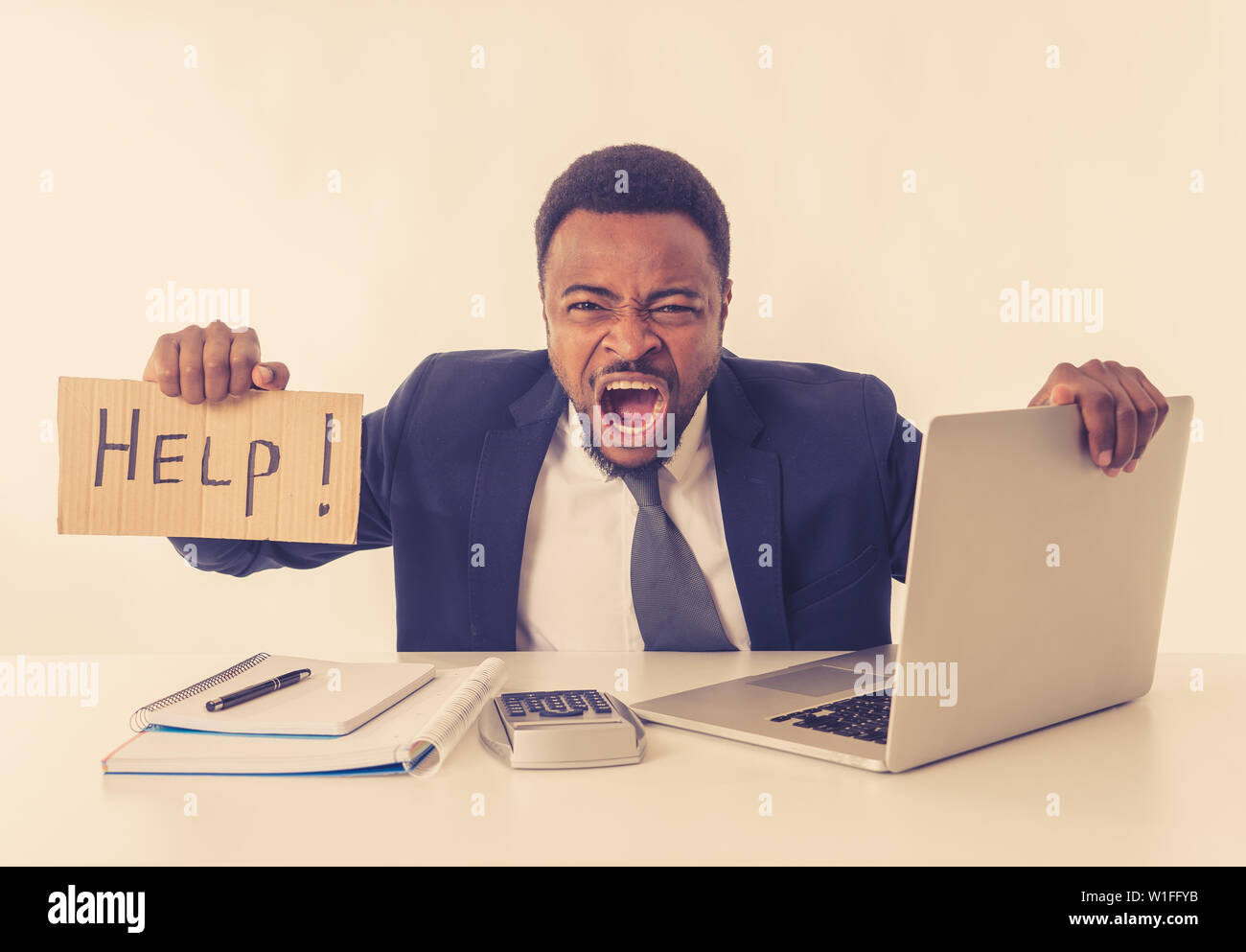 Desperate african american businessman with laptop computer suffering ...