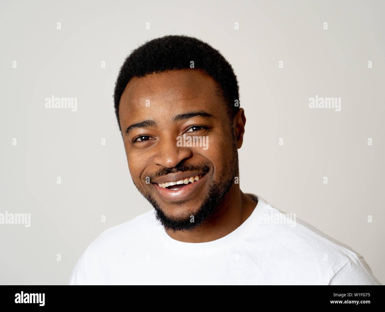 Portrait of smiling man having fun and joy smiling and laughing at the ...