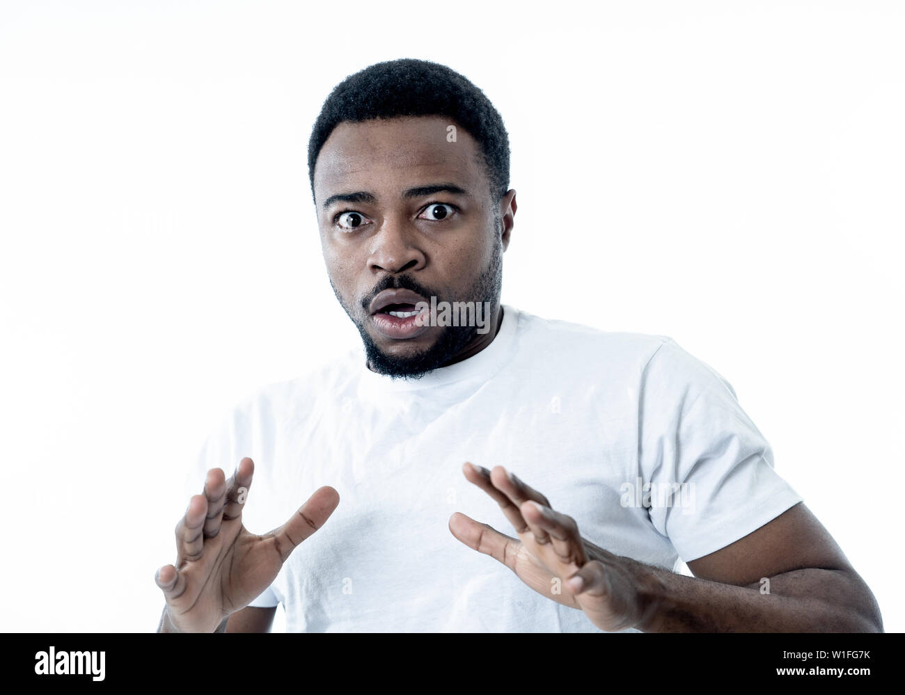 Portrait of Handsome young man in shock with a scared expression on his ...