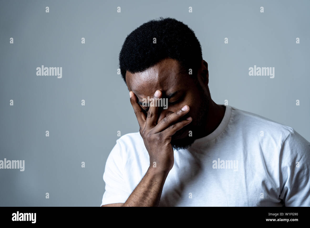 Portrait of attractive man sad and depressed suffering depression ...