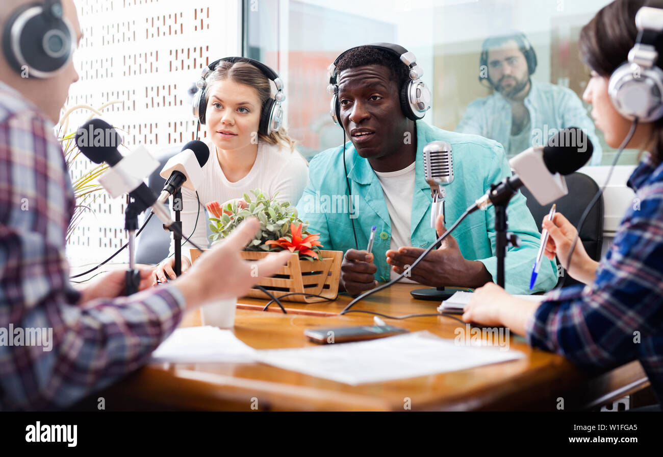 Scandal interview. Two outraged guests answering provocative questions ...