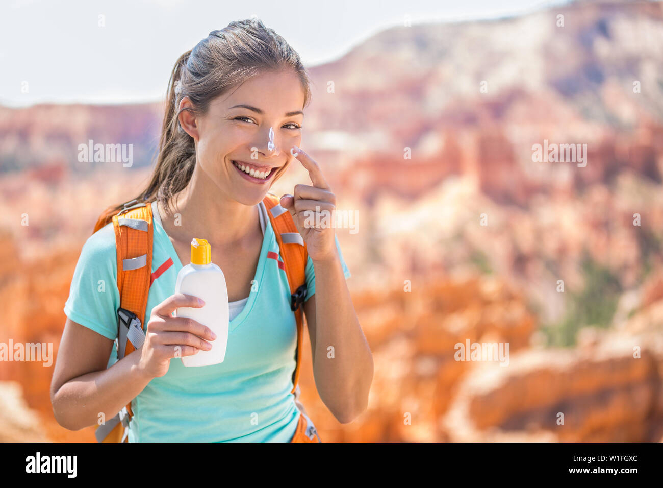 Apply sunscreen hi-res stock photography and images - Alamy