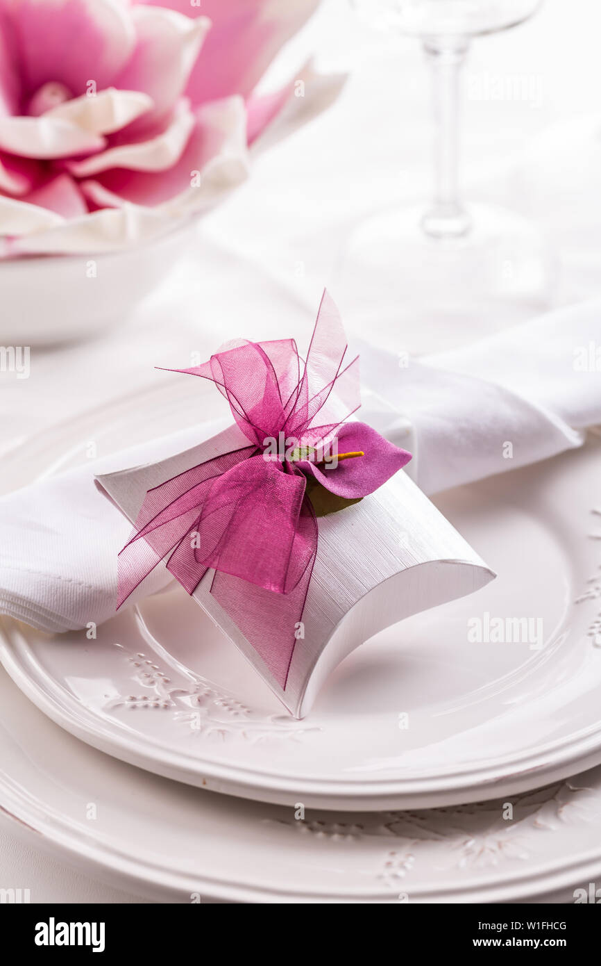 Beautiful table setting with small present for the guest Stock Photo ...