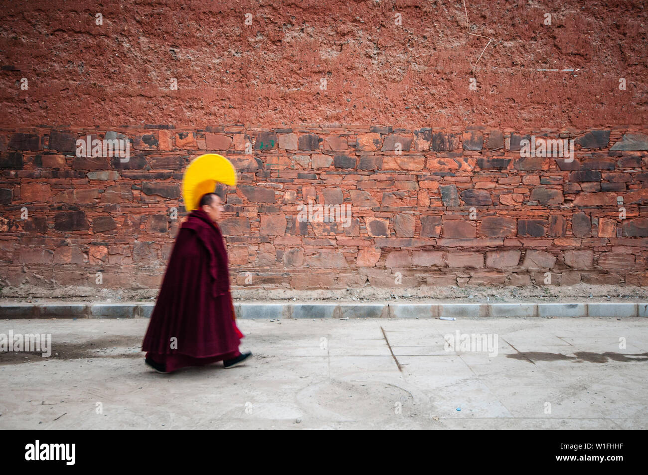 wall people wear building brick Stock Photo - Alamy