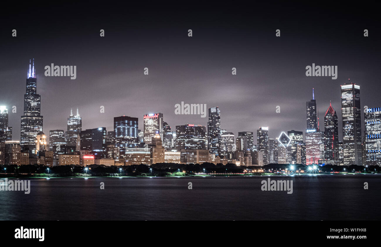Skyline of Chicago by night - view from Lake Michigan Stock Photo - Alamy