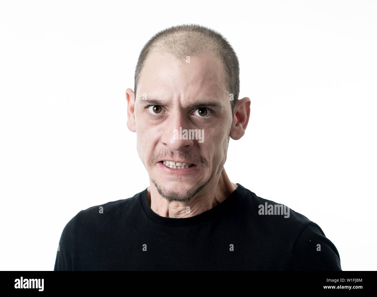 Portrait of angry and upset young man looking furious, aggressive and ...