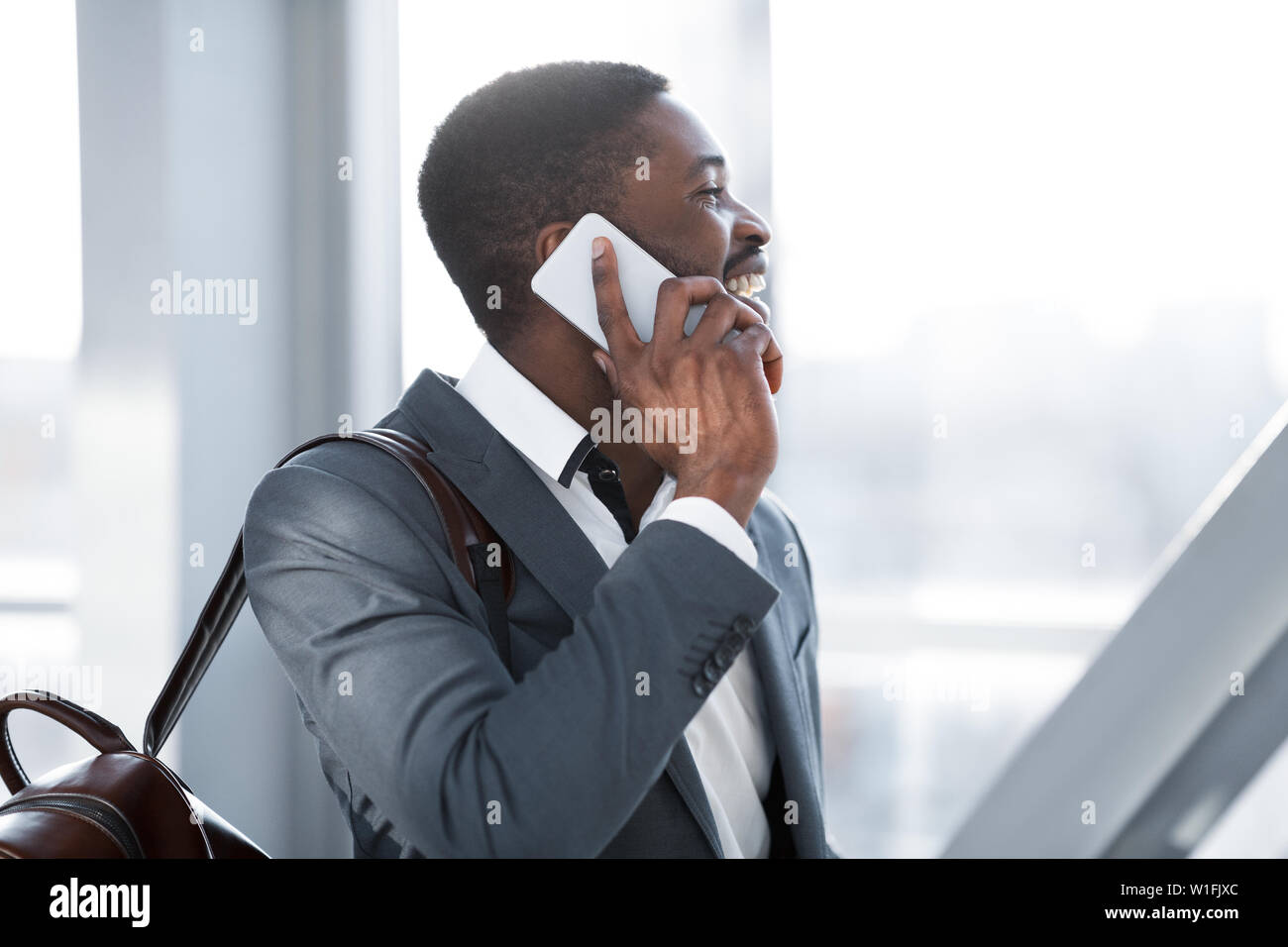 Travelling Businessman Making Phone Call, Arriving at Airport Stock ...