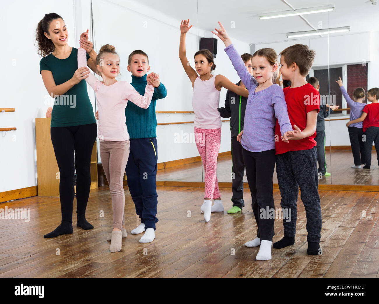 Glad children studying of partner dance at dance school Stock Photo - Alamy