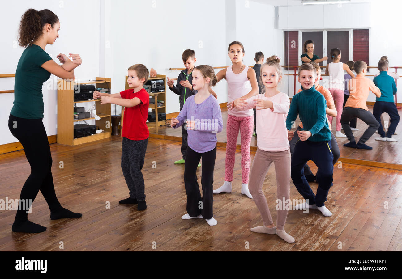 Active spanish children studying folk style dance in class Stock Photo ...