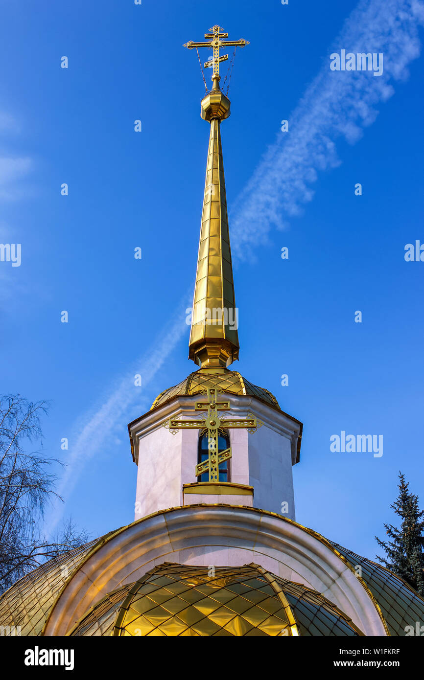 The Golden Cross on the Tower of the Church Stock Photo - Alamy