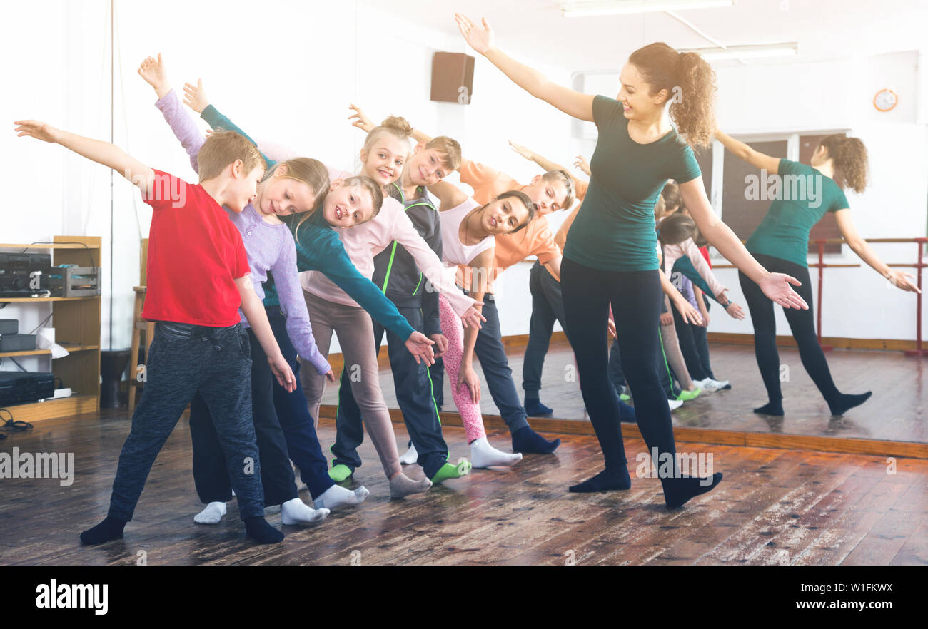 Caucasian boys and girls studying contemp dance in studio Stock Photo ...