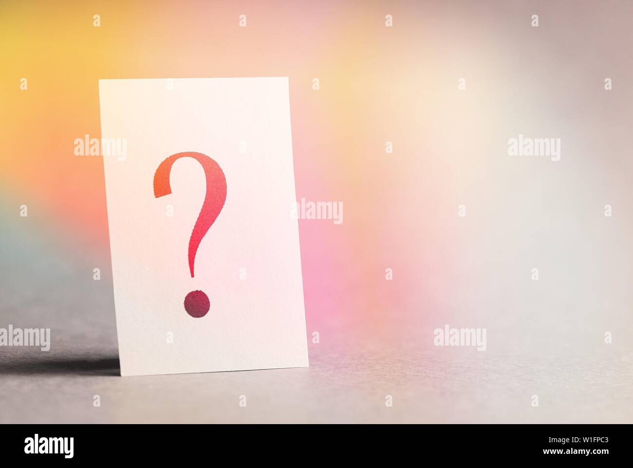 Paper card with a question mark on a gray background, concept Stock ...