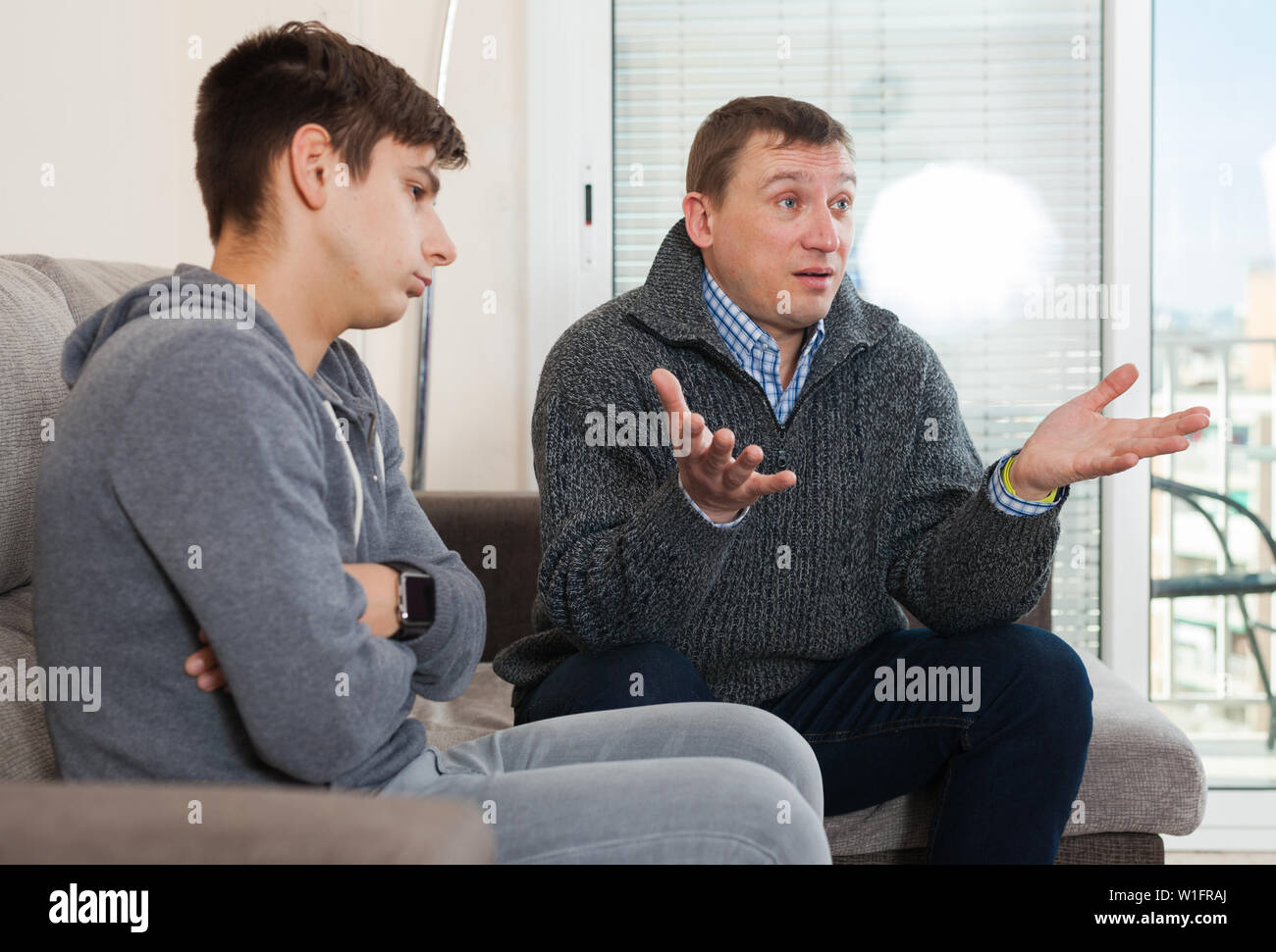 Angry father screaming at offender son Stock Photo - Alamy