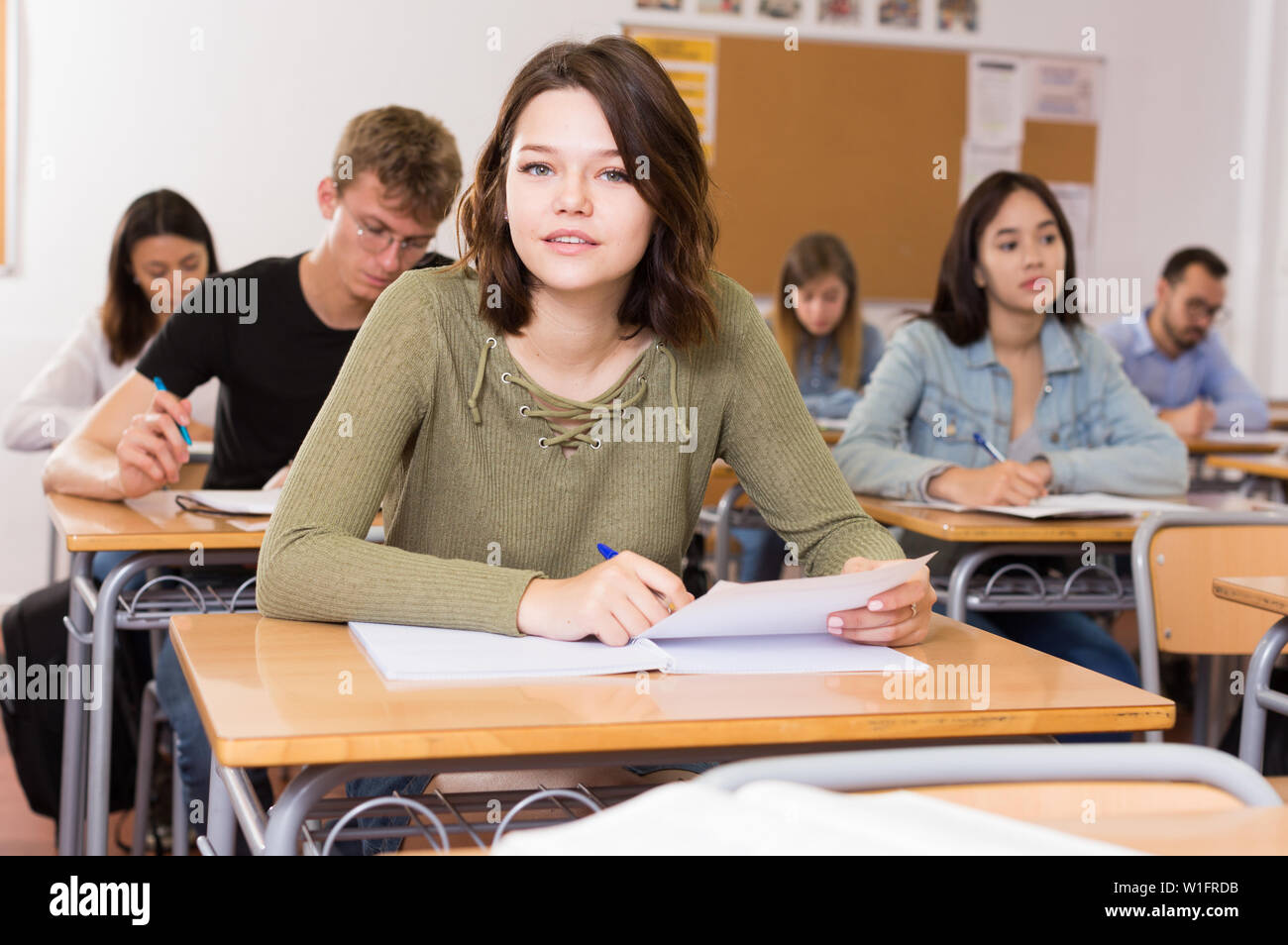 Teenage student answering question studying hi-res stock photography ...