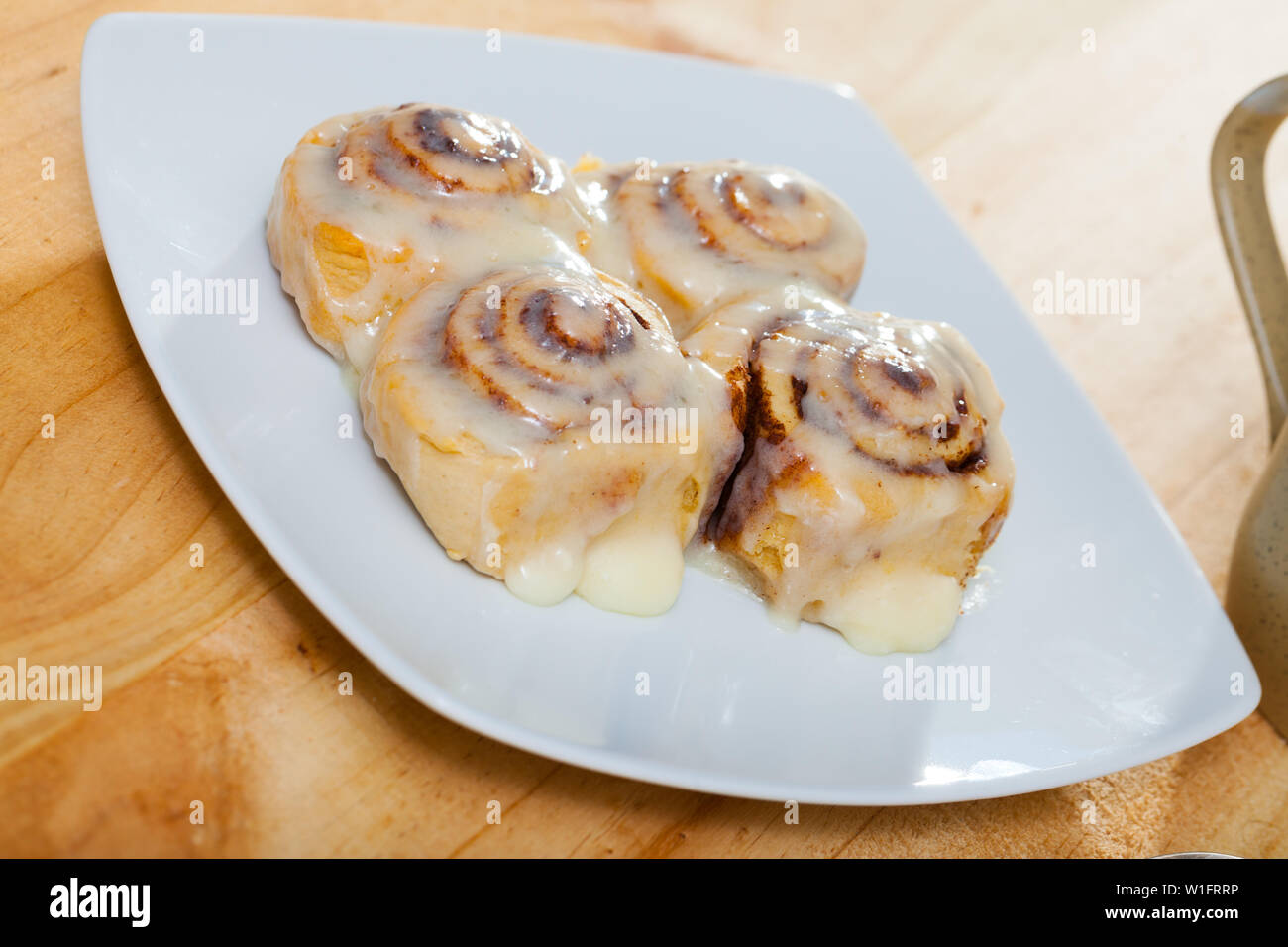 Vegan cinnabon rolls with topping Stock Photo - Alamy