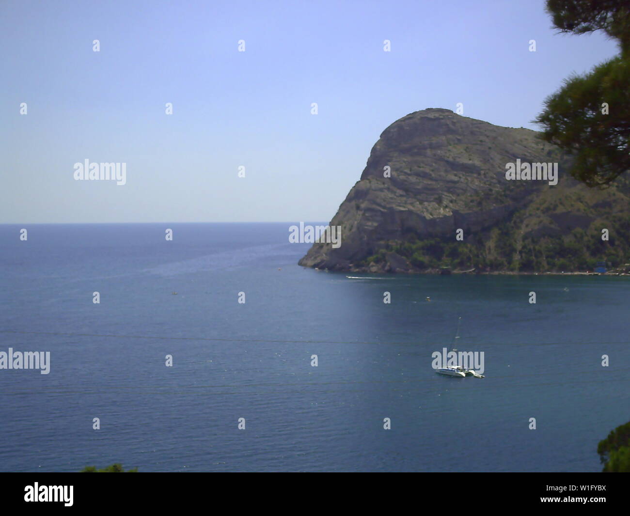 Bright, summer seascape with the rocky Black Sea coast in the Crimea ...