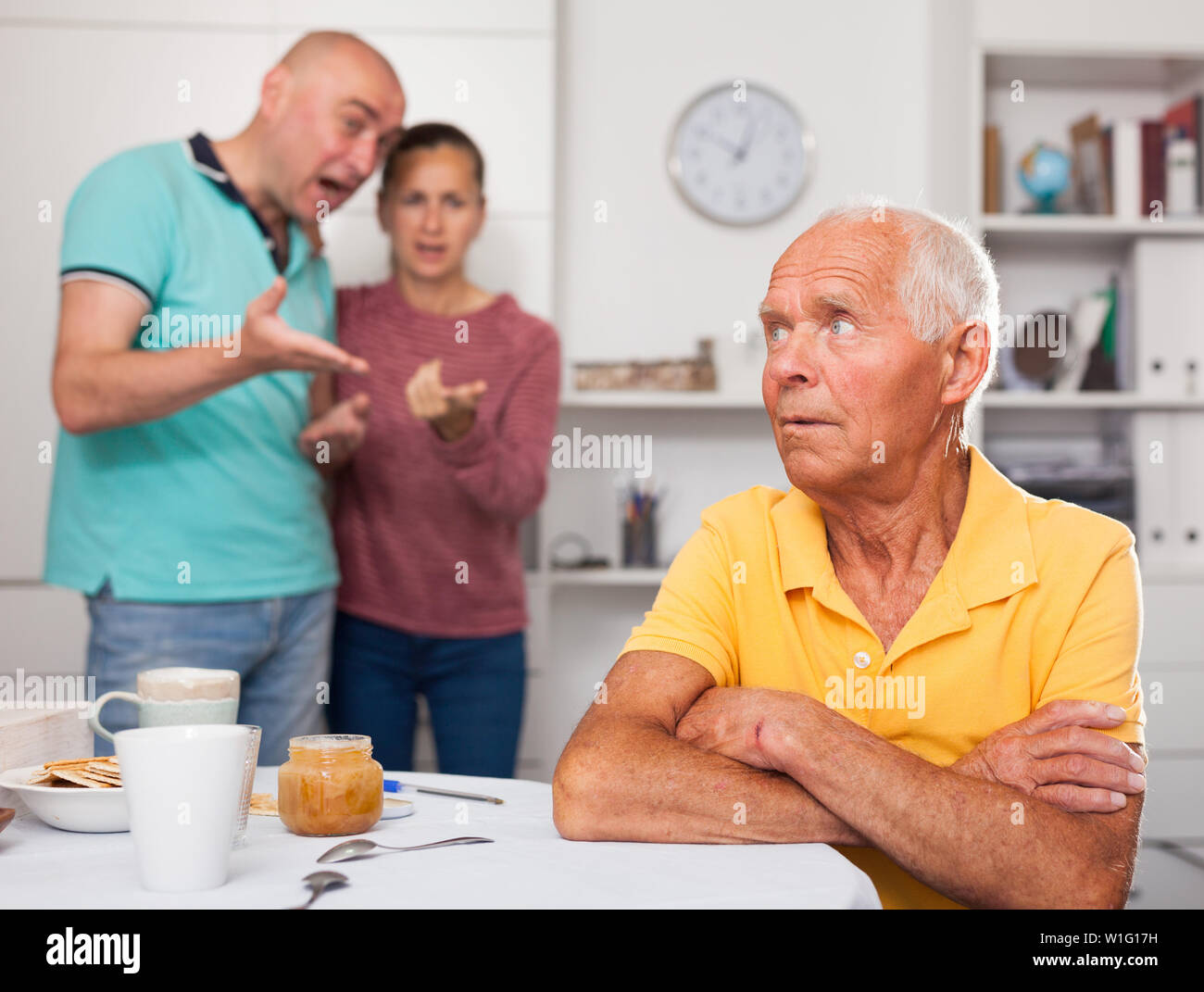 Home quarrel between father and adult children Stock Photo - Alamy