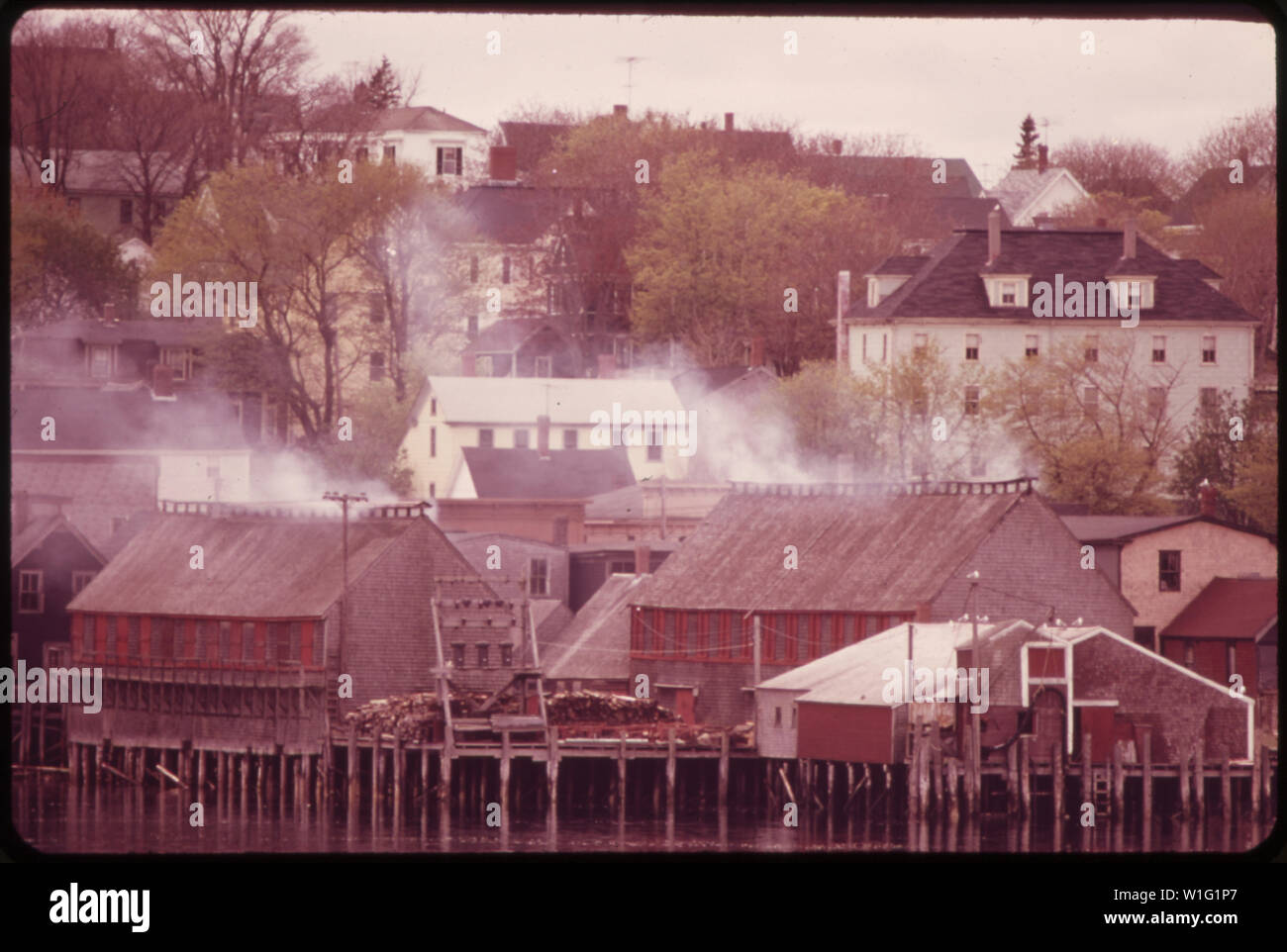 LUBEC, LOOKING WEST FROM CAMPOBELLO ISLAND. SMOKE IS EMITTED BY THE ...