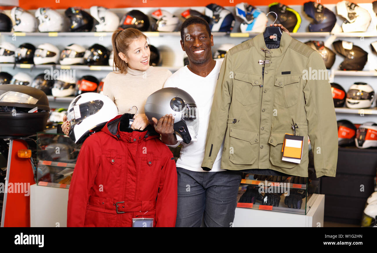 Smiling positive female and male customers satisfied with purchases in ...