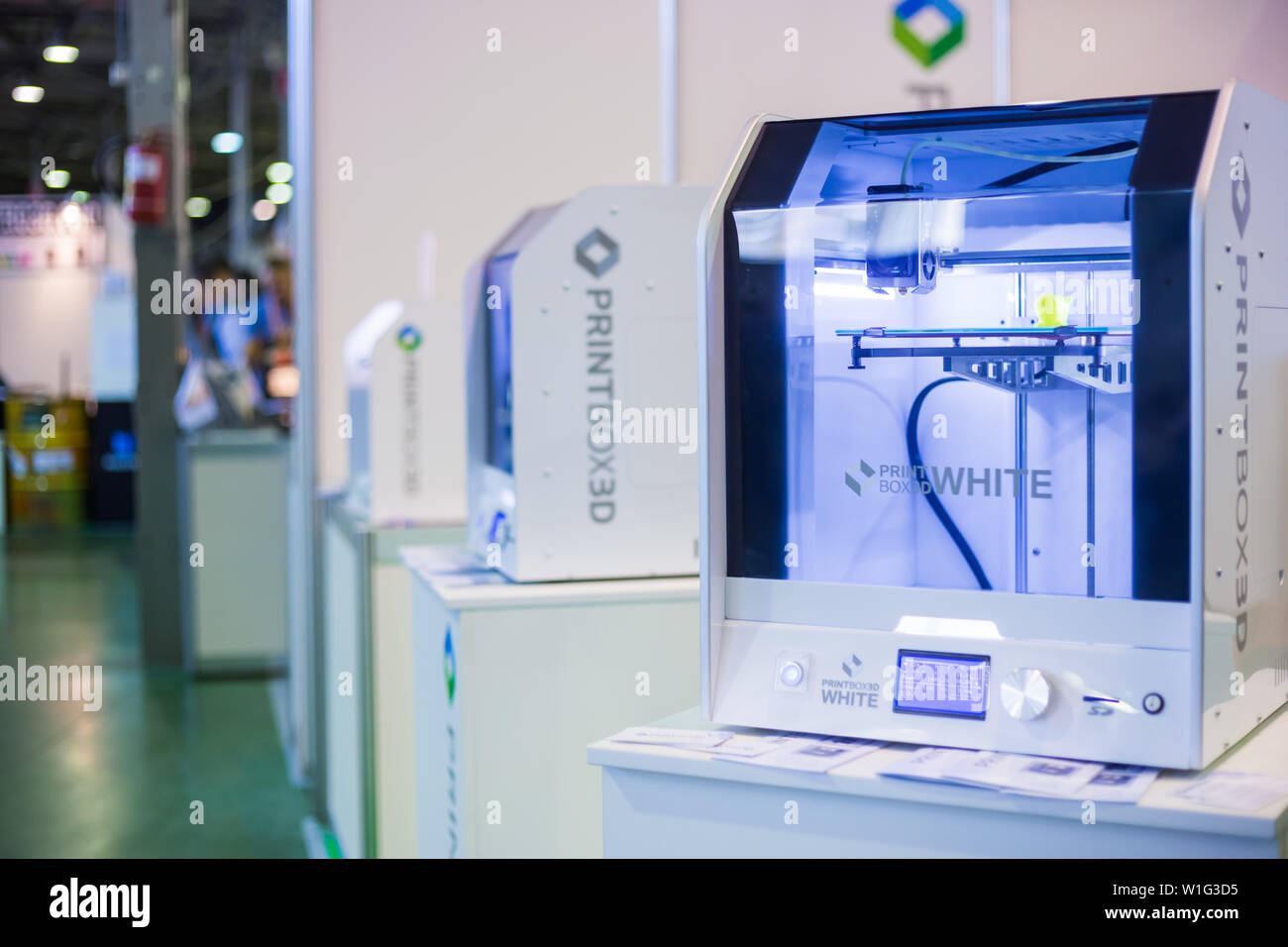 Automatic 3D printers working at modern technology exhibition Stock ...