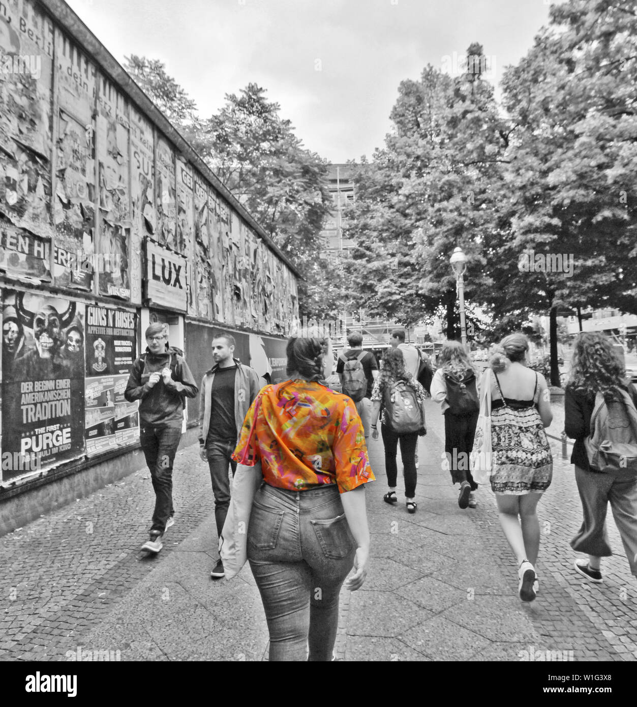 A pop of colour as people walk through the streets of Berlin Stock ...